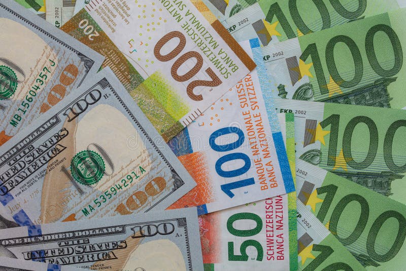 Closeup of 50, 100 and 200 Swiss Franc Banknotes and 100 Euro and 100 ...