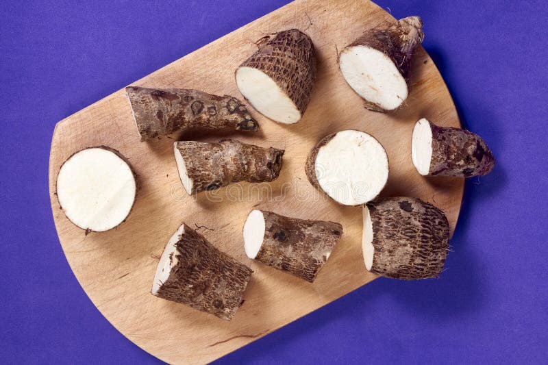 Closeup of Taro Root Vegetable, Eddo Malanga, Purple Background Stock ...