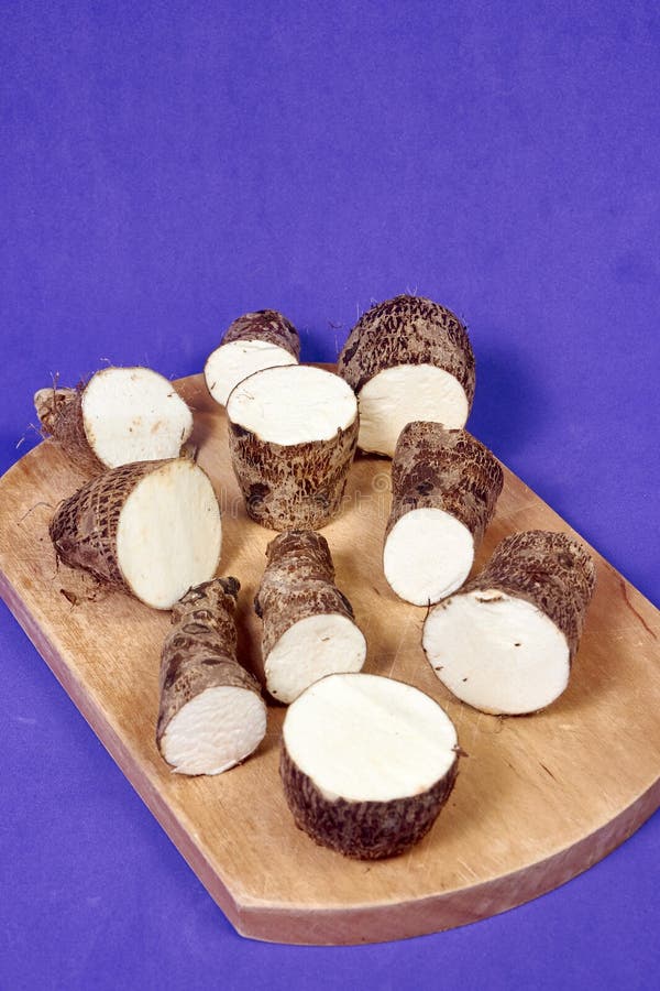 Closeup of Taro Root Vegetable, Eddo Malanga, Purple Background Stock ...