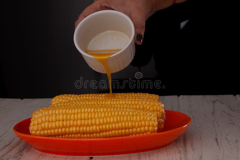 Closeup of Tasty Corn with Melted Butter Pouring on it Stock Photo ...