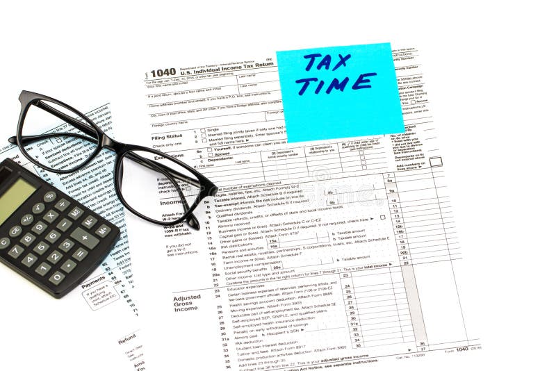 Tax Time Written on a Bright Sticker Note Paper Clip for a Tax ...