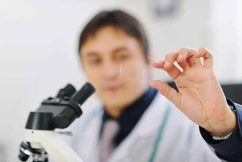 Closeup on Test Sample in Hand of Male Researcher Stock Photo - Image ...