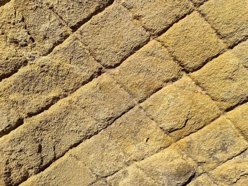 Texture of the Wall Built of Rough Yellow Stone Blocks Stock Image ...