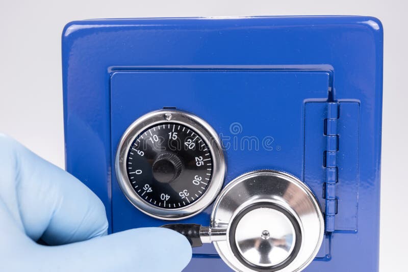 Closeup of a Thief`s Hand with Stethoscope while Unlocking Safe Stock ...