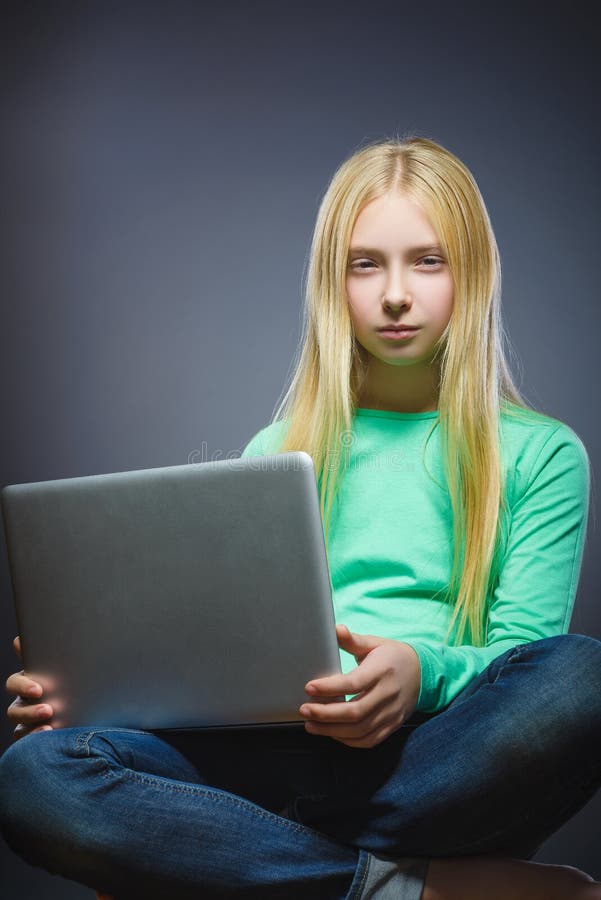 Closeup Thoughtful Or Contemptuous Girl Using Laptop Isolated Grey
