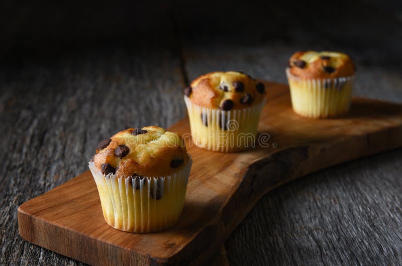 Closeup of Three Mini Chocolate Chip Muffins on a Cutting Board. Stock ...
