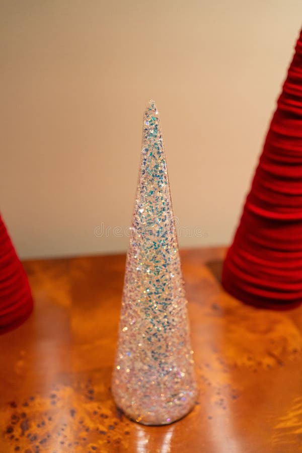 Closeup of Three Multi-colored Glitter-covered Cones on Top of a Table ...
