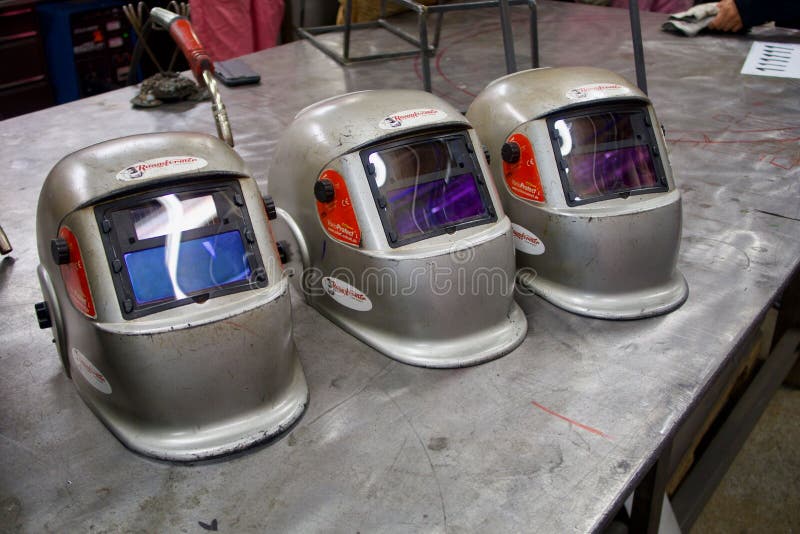 Closeup of Three Welding Helmets on a Welding Table for Manufacturing ...