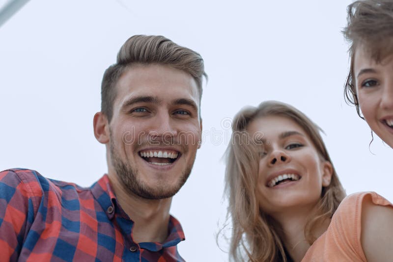 Closeup of Three Young People Smiling on White Background Stock Image ...