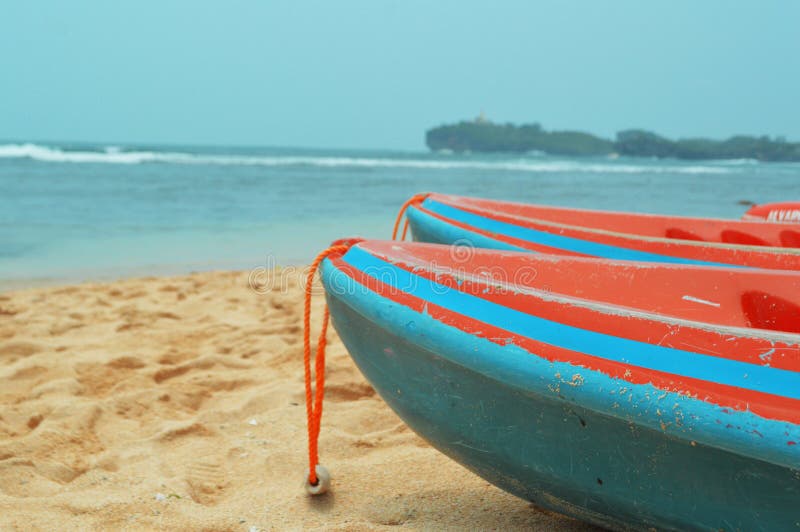 Closeup of the Tip of the Rubber Boat and the Beach Sand with the Ocean ...