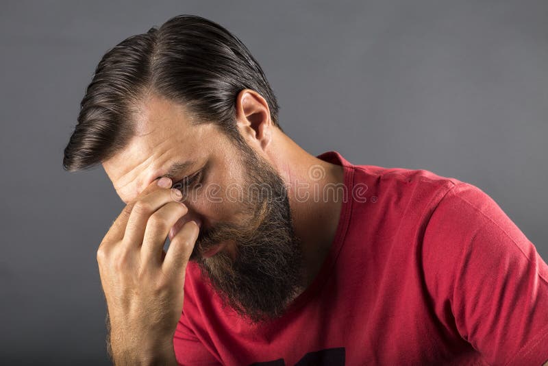 Closeup of a Tired Young Man Stock Image - Image of background ...