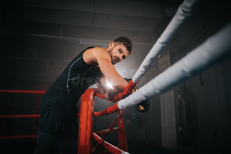 Closeup To the Camera in a Boxing Ring Great Looking Guy Get Ready for ...