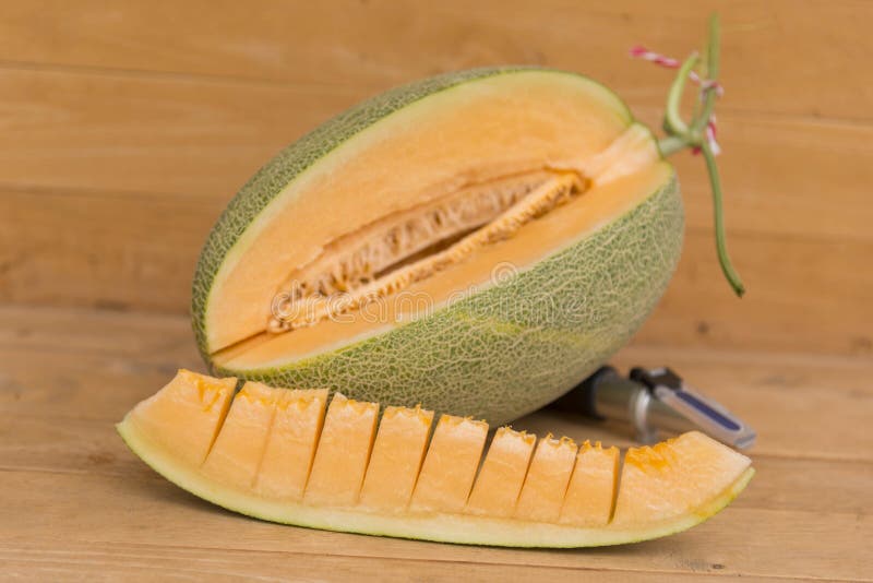 Split the Orange Melon on Wood Plate Stock Photo - Image of background ...