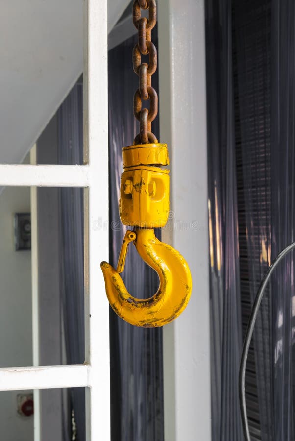 Closeup To Yellow Hook with Rusty Chain Stock Photo - Image of load ...