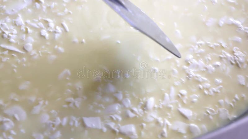Closeup, Top View of a Worker Separating the Whey from Curds during ...