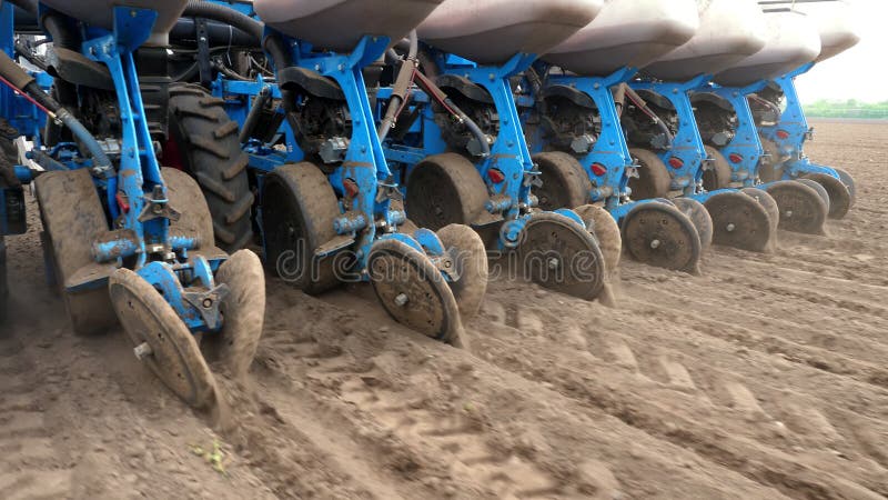 Closeup of Tractor with Seeder in the Field. Sowing of Corn, Maize in ...