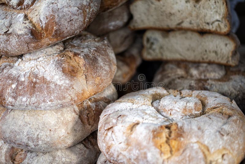 Closeup of Traditional Hand Made Bread Stacked on a Shelf in a Bakery ...