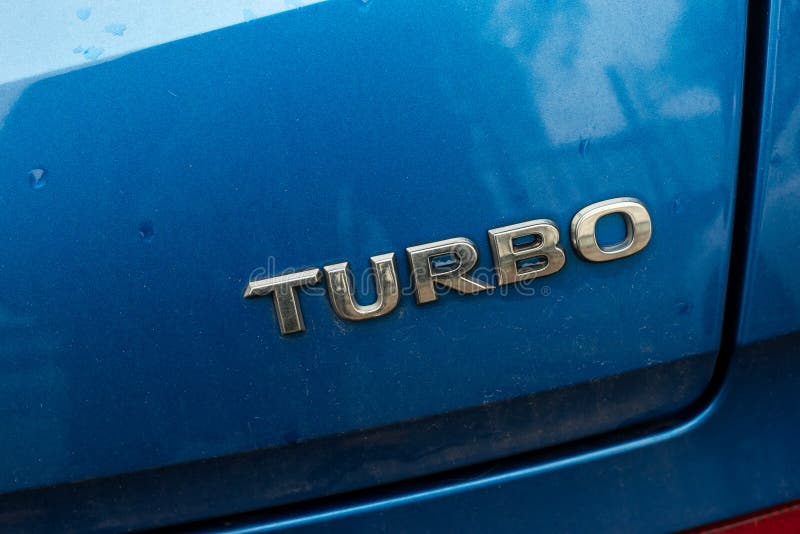 Turbo sign on red car stock image. Image of model, closeup - 165743171