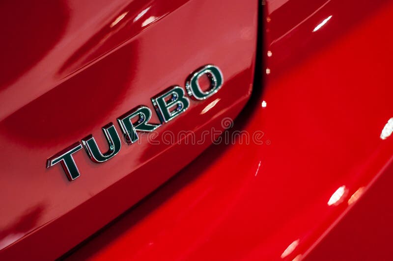 Turbo sign on red car stock image. Image of model, closeup - 165743171
