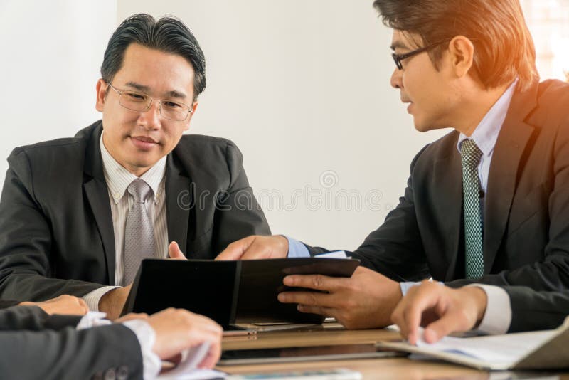 Two Middle-aged Businessman Talking about the Business Together Stock ...