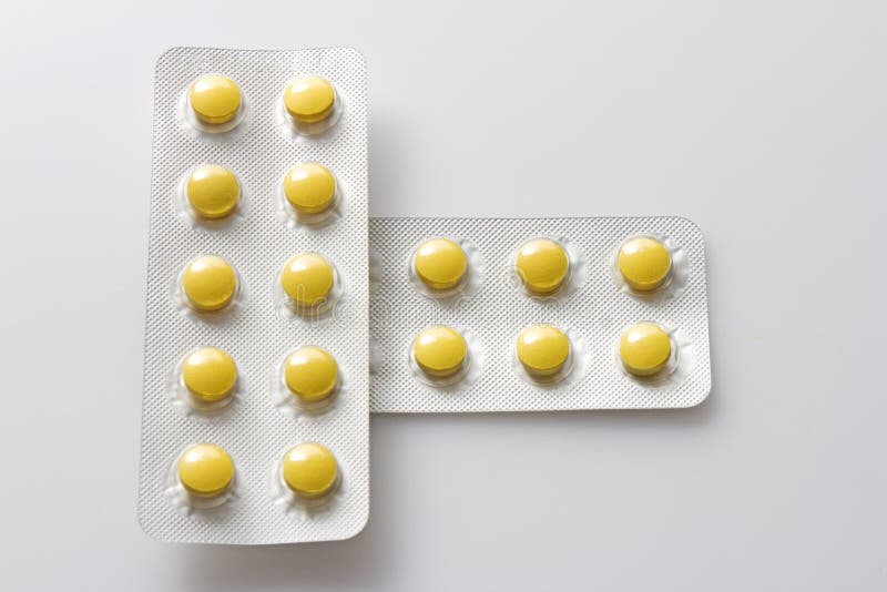 Closeup of Two Pill Tablets Isolated on a White Surface Stock Image ...