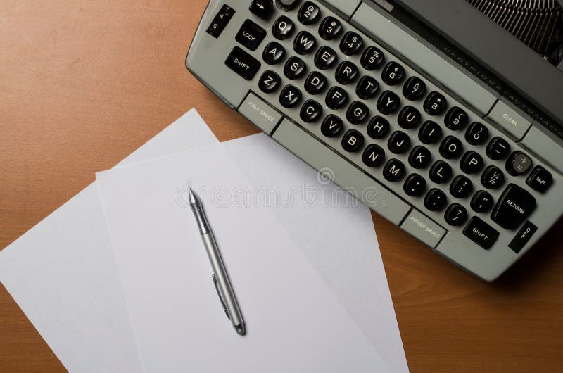 Closeup of a Typewriter with Blank Papers and a Pen. Concept of Writing ...