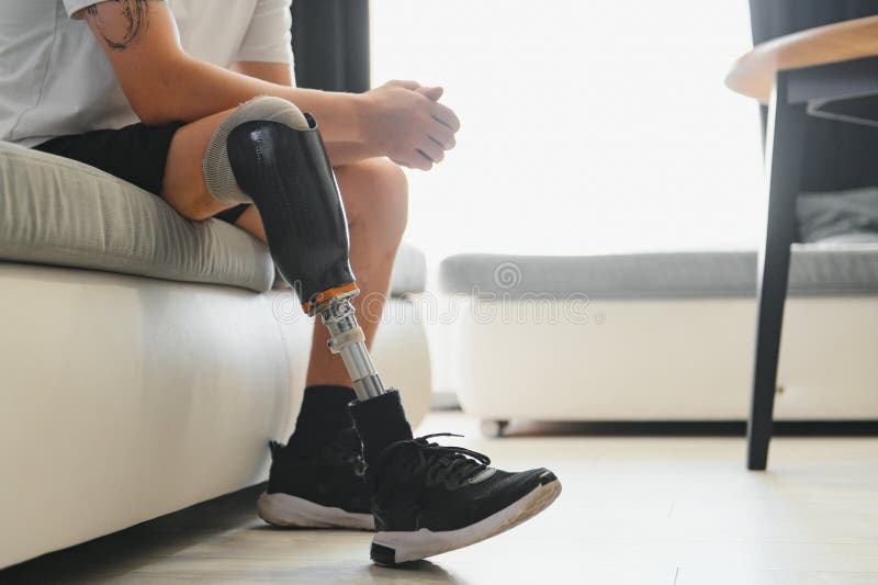Closeup of Unrecognizable Man with Bionic Prosthetic Leg at Home ...