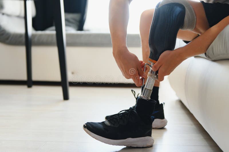 Unrecognizable Man with Bionic Prosthetic Leg at Home Indoors, Copy ...