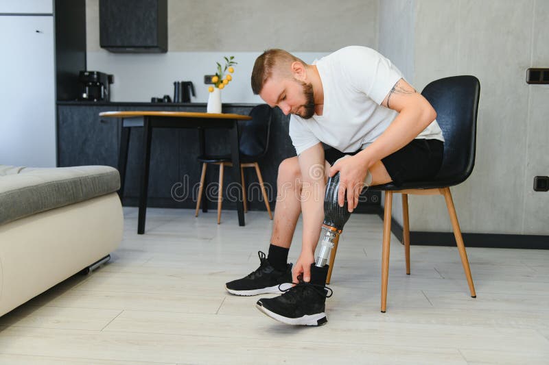 Unrecognizable Man with Bionic Prosthetic Leg at Home Indoors, Copy ...