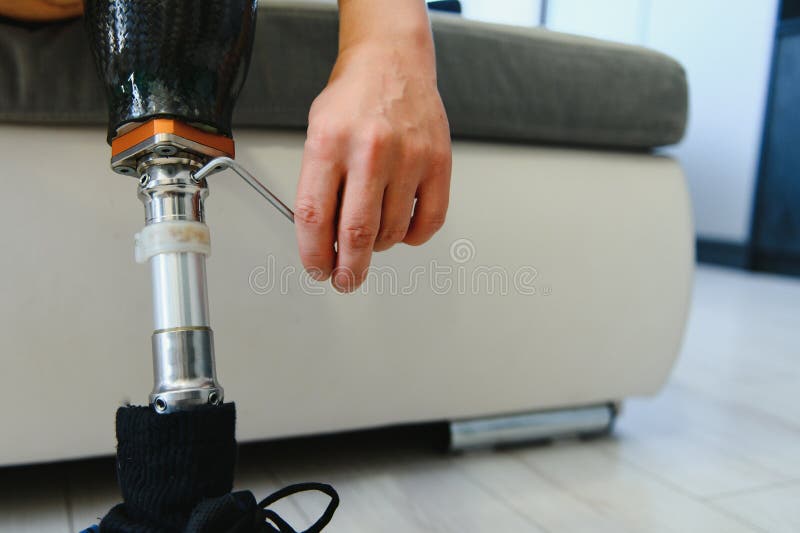 Unrecognizable Man with Bionic Prosthetic Leg at Home Indoors, Copy ...