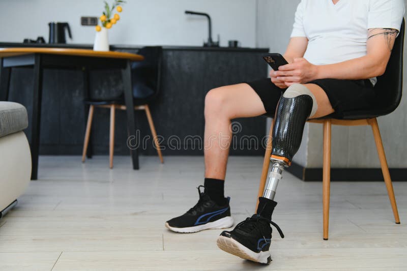 Unrecognizable Man with Bionic Prosthetic Leg at Home Indoors, Copy ...