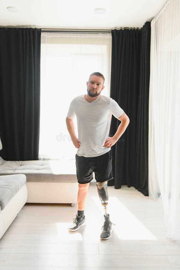 Unrecognizable Man with Bionic Prosthetic Leg at Home Indoors, Copy ...