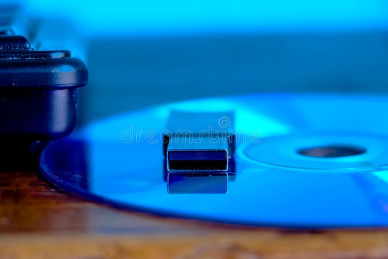 Closeup of a Usb Flash Drive on a Disc Against a Blue Light. Stock ...
