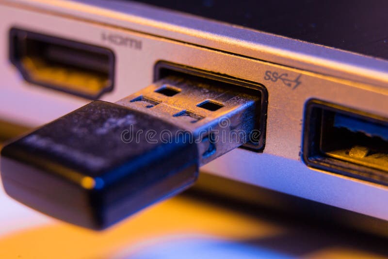 Closeup of USB Flash Drive Inserted into Port on the Side of a L Stock ...