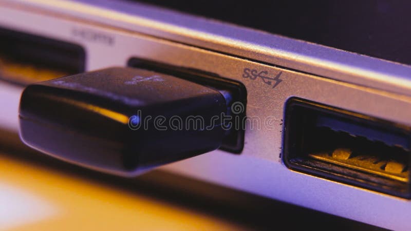 Closeup of USB Flash Drive Inserted into Port on the Side of a L Stock ...