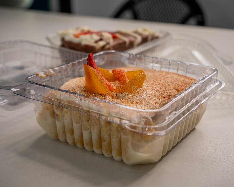 Closeup of Vanilla Cake with Fruits in a Plastic Box on a White-colored ...