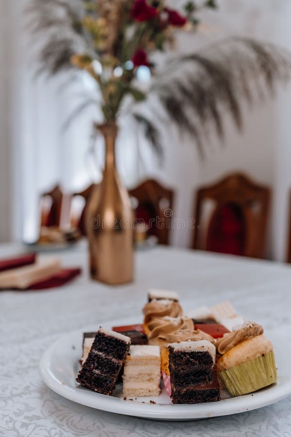 Closeup of a Variety of Cake Pieces Cut into Cubes Served on a Plate ...