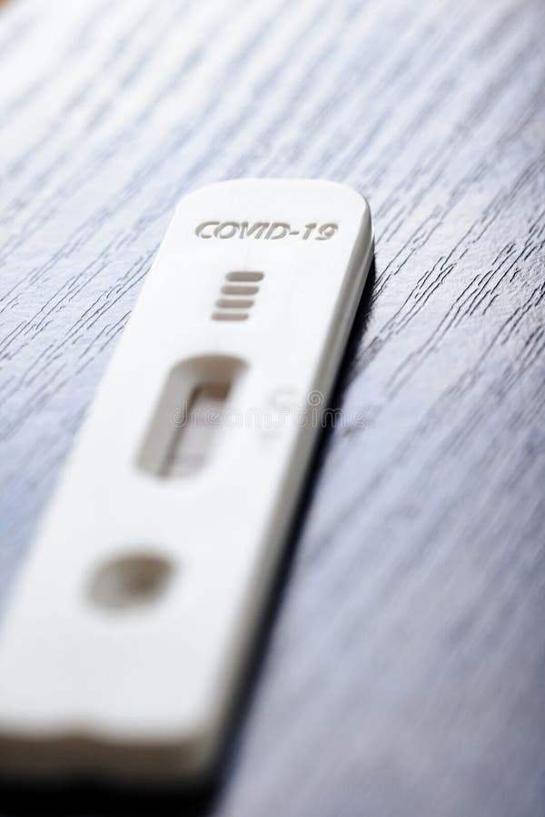 Closeup Vertical Image of a Positive COVID-19 Self-test. Stock Image ...