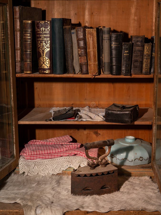 A Very Old Rusty Iron and Books in a Bookshelf Editorial Stock Image ...