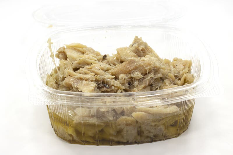 Closeup of a Vicenza-style Cod Inside a Plastic Container on White ...