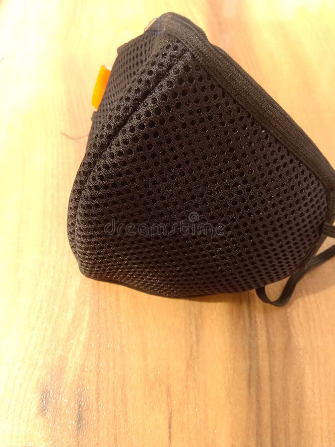 A Closeup View of a Black Mask with Three Layer Protection Against ...