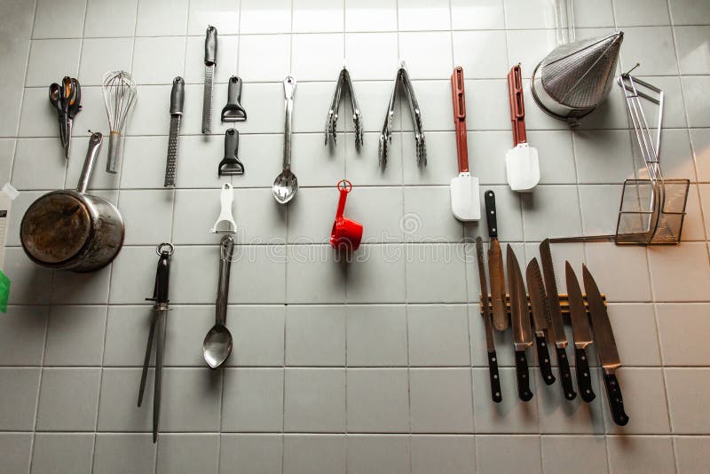 Kitchen Utensils Hanging on Wall Stock Image - Image of objects, life ...