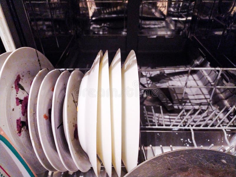 Closeup View of Dirty Dishes Stacked Inside a Dishwasher, Ready for ...