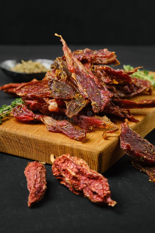 Closeup View of Dried Lamb Jerky Slices with Salt and Chilli Pepper ...