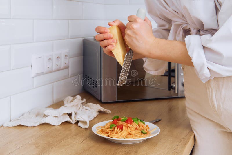 Closeup View of Female Hands Rub Cheese on a Grater Stock Image - Image ...