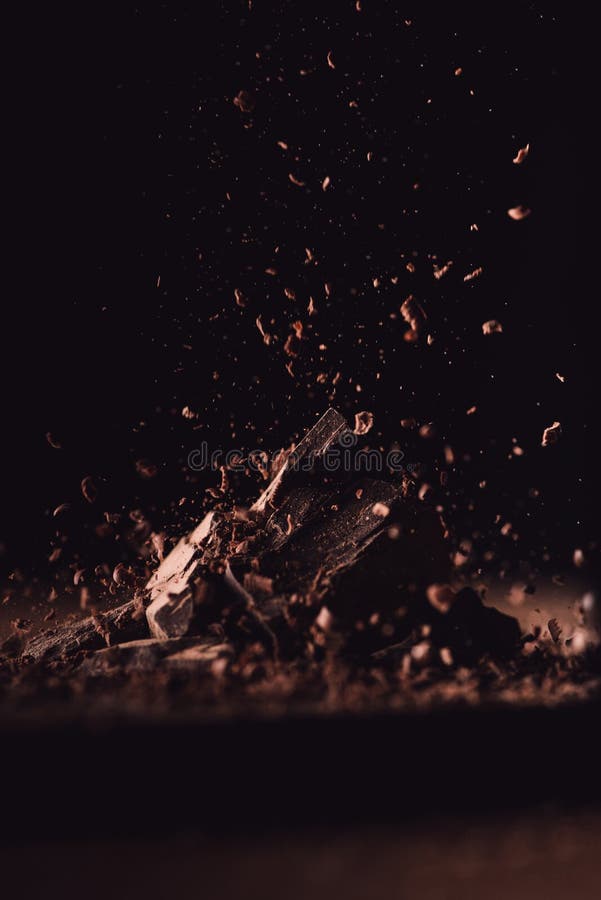Closeup View of Grated Dark Chocolate Falling on Pieces of Chocolate ...
