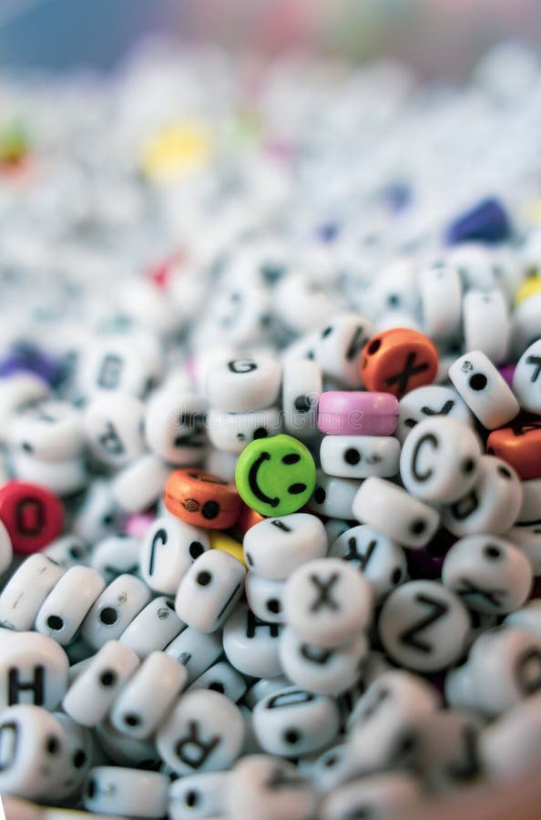 Closeup View of a Green Smiley Face on a Bunch of Letter Cubes Stock ...