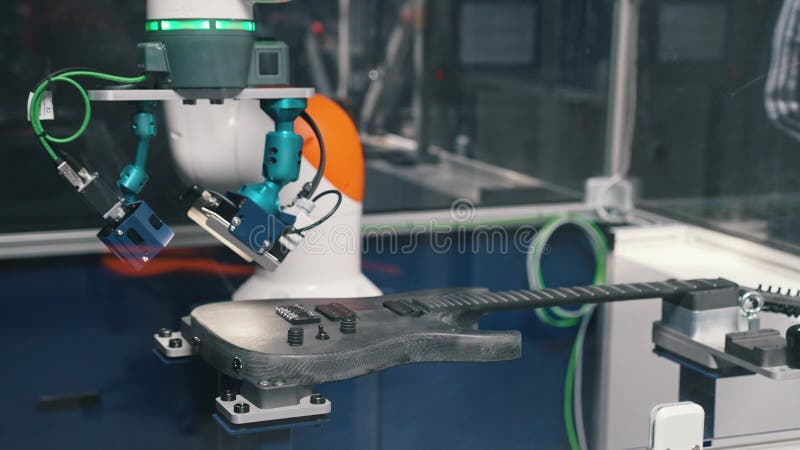 Closeup View of the Guitar Paint Control Using Robot Arm, Modern ...