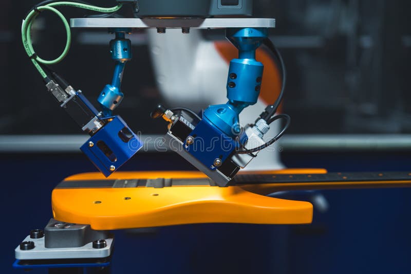 Closeup View of the Guitar Paint Control Using Robot Arm, Modern ...