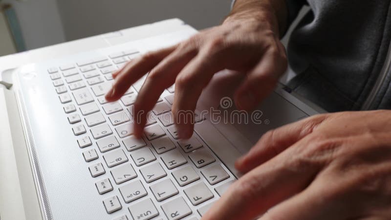 Closeup View of Hands Typing on a White Laptop Computer Keyboard, on a ...
